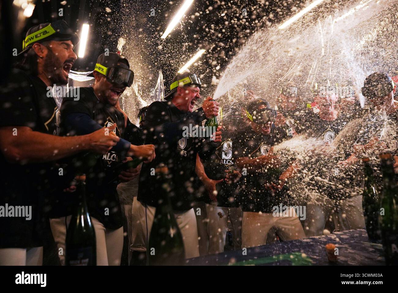 Seattle Mariners manager Dan Wilson, third from left, leads his team in ...