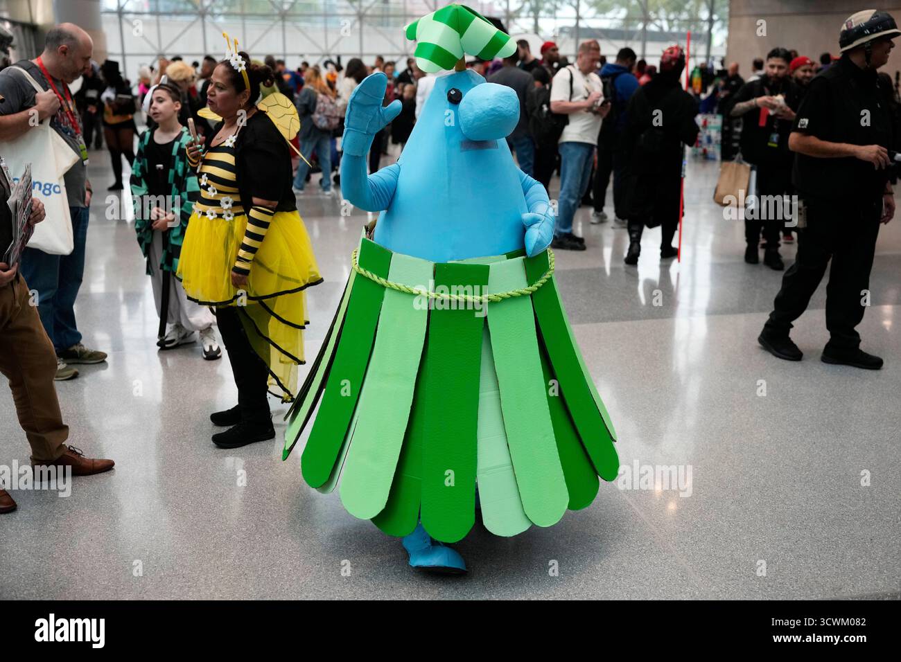 An attendee dressed as a Pianta from Mario poses during New York Comic ...