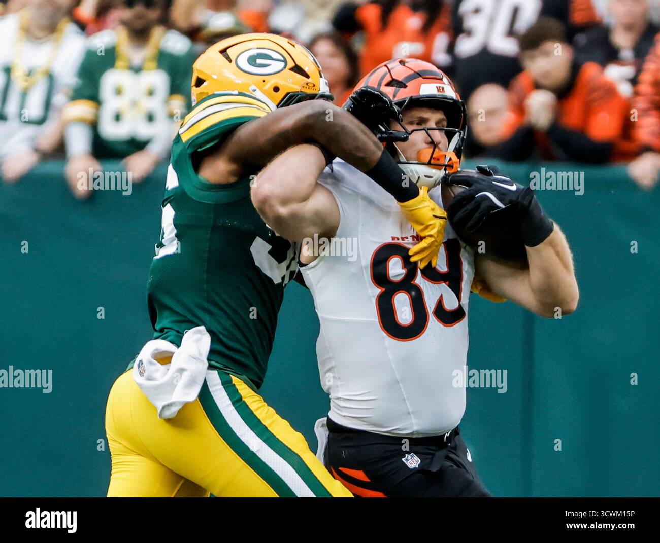 Green Bay Packers linebacker Edgerrin Cooper (L) tackles Cincinnati ...