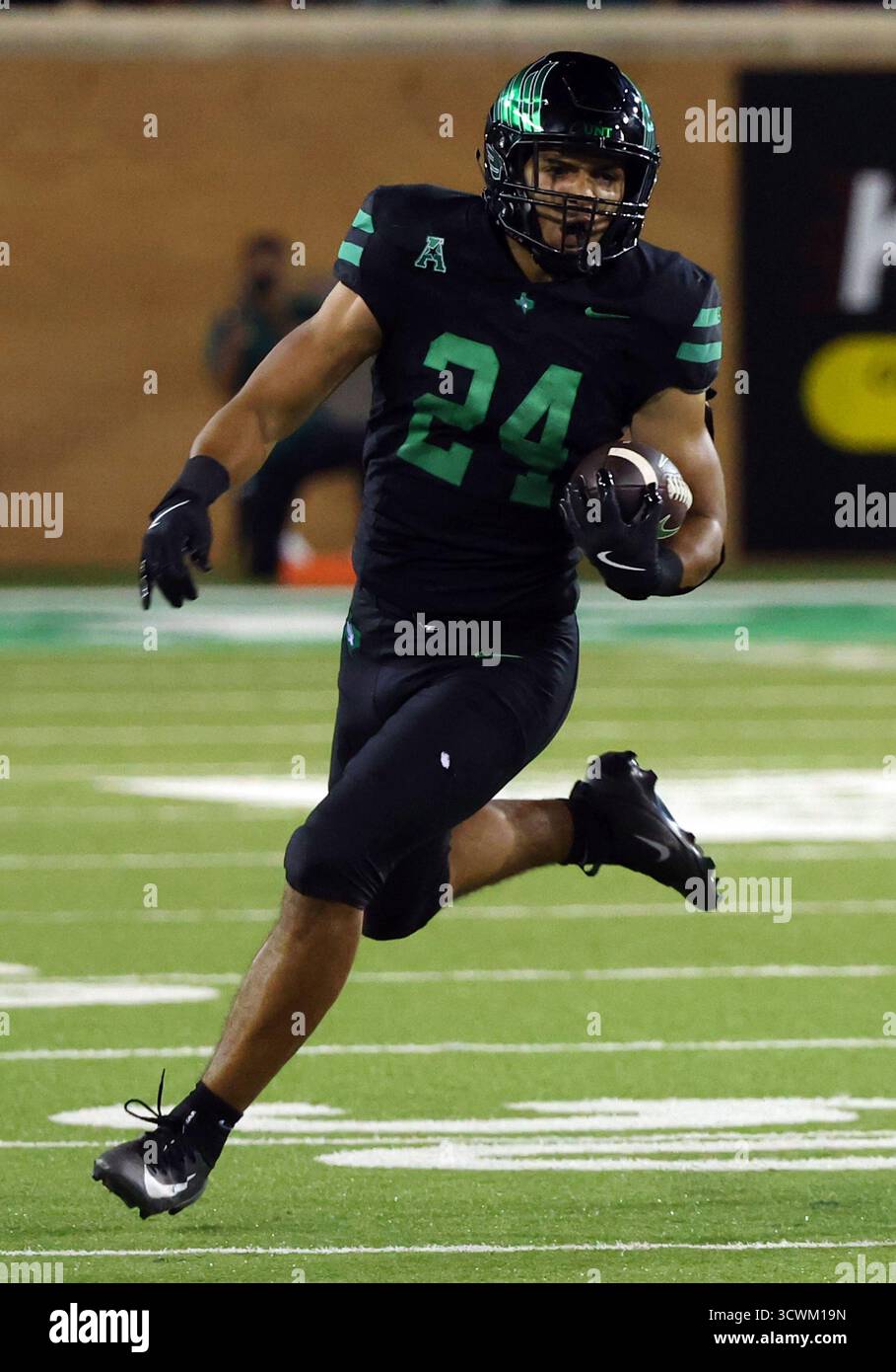 North Texas running back Caleb Hawkins (24) carries the ball against ...