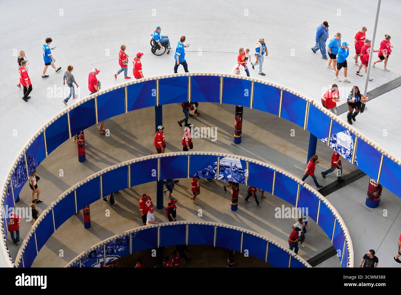 Fans walk up a ramp leading to a seating area inside Arrowhead Stadium ...