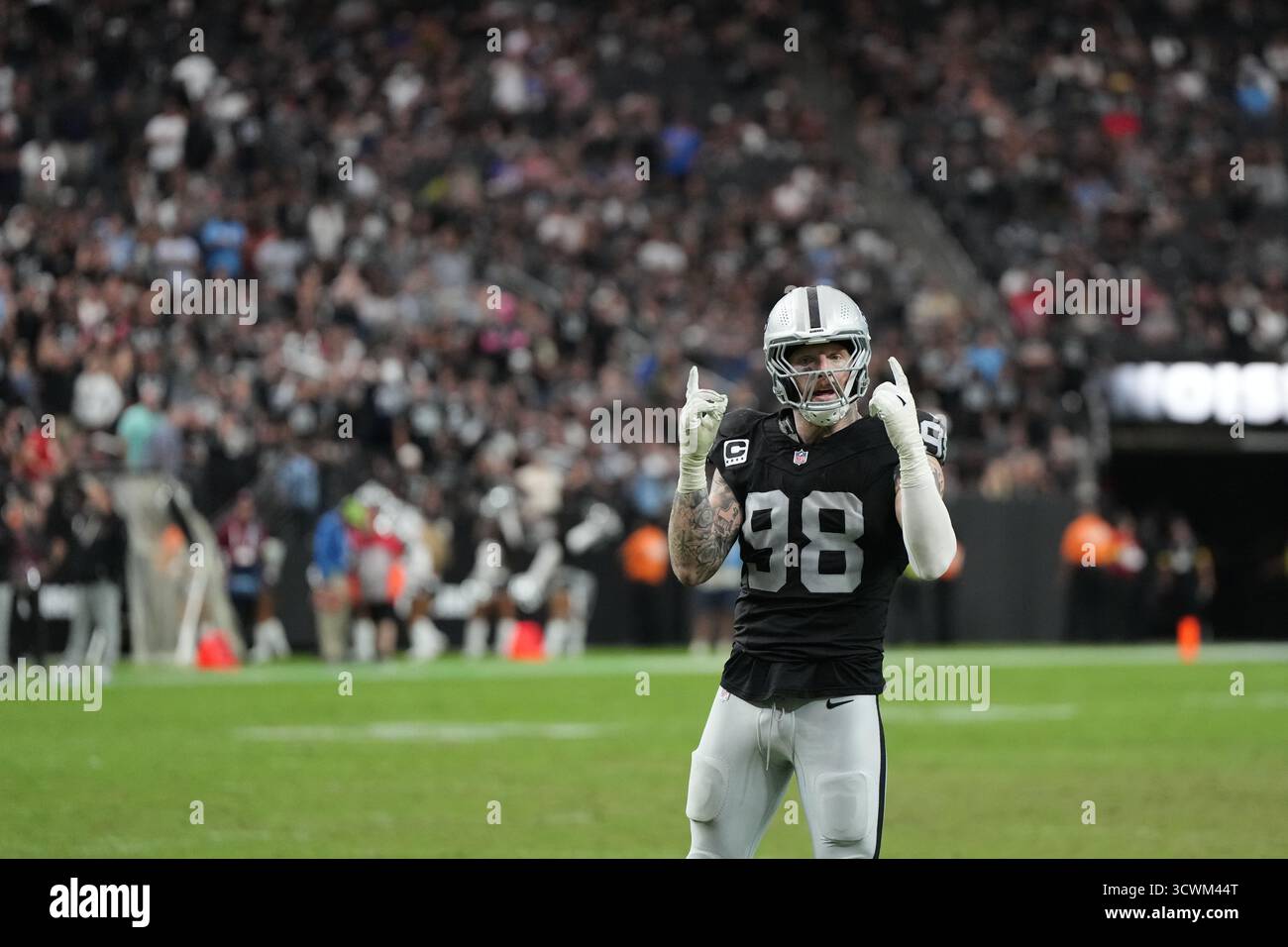 Las Vegas Raiders defensive end Maxx Crosby (98) reacts after a play ...