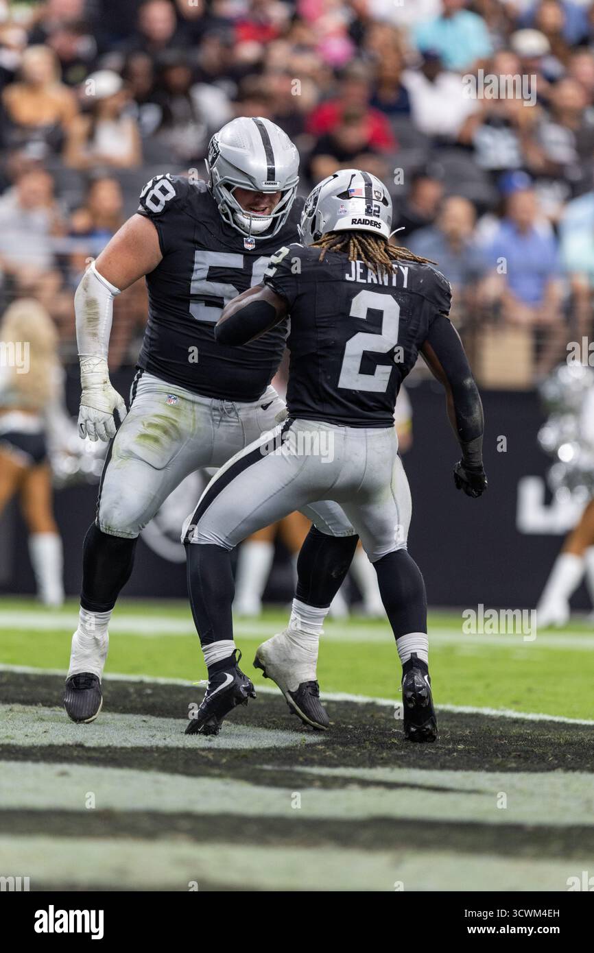 Las Vegas Raiders running back Ashton Jeanty (2) scores a touchdown and dances with teammate ...