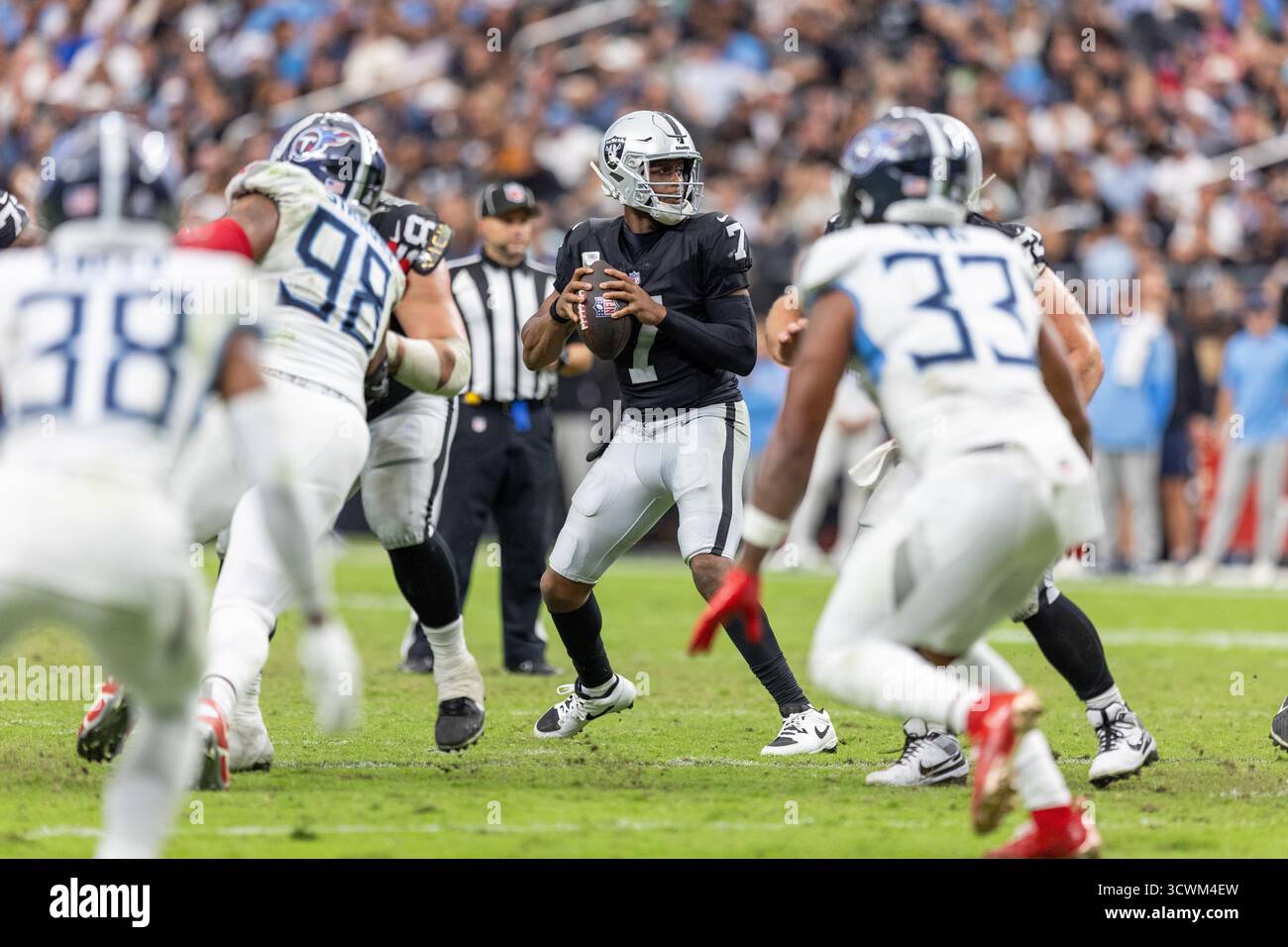 Las Vegas Raiders quarterback Geno Smith (7) drops back to pass against ...