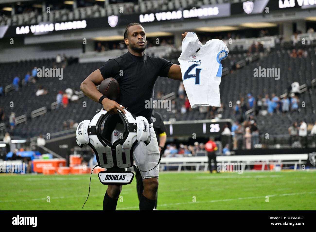 Las Vegas Raiders quarterback Geno Smith (7) walks off the field after ...