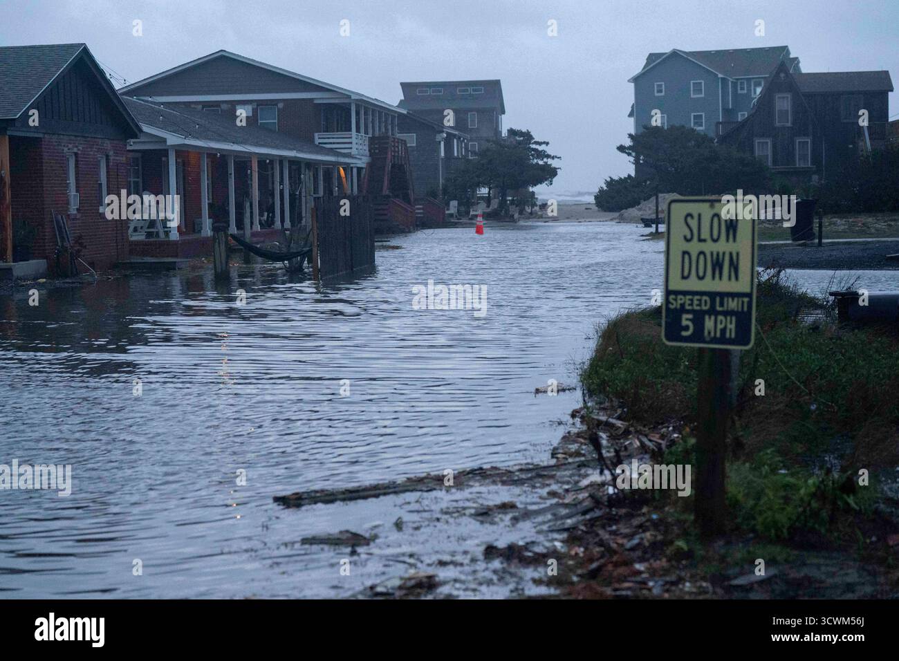 A road is inundated in the midst of a storm, Sunday, Oct. 12, 2025, in ...