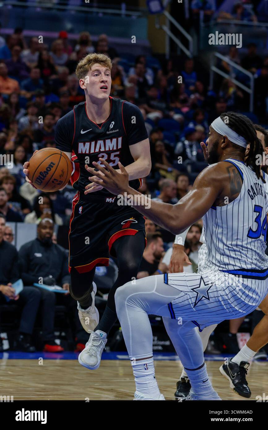 Miami Heat guard Kasparas Jakučionis (25) is defended by Orlando Magic ...