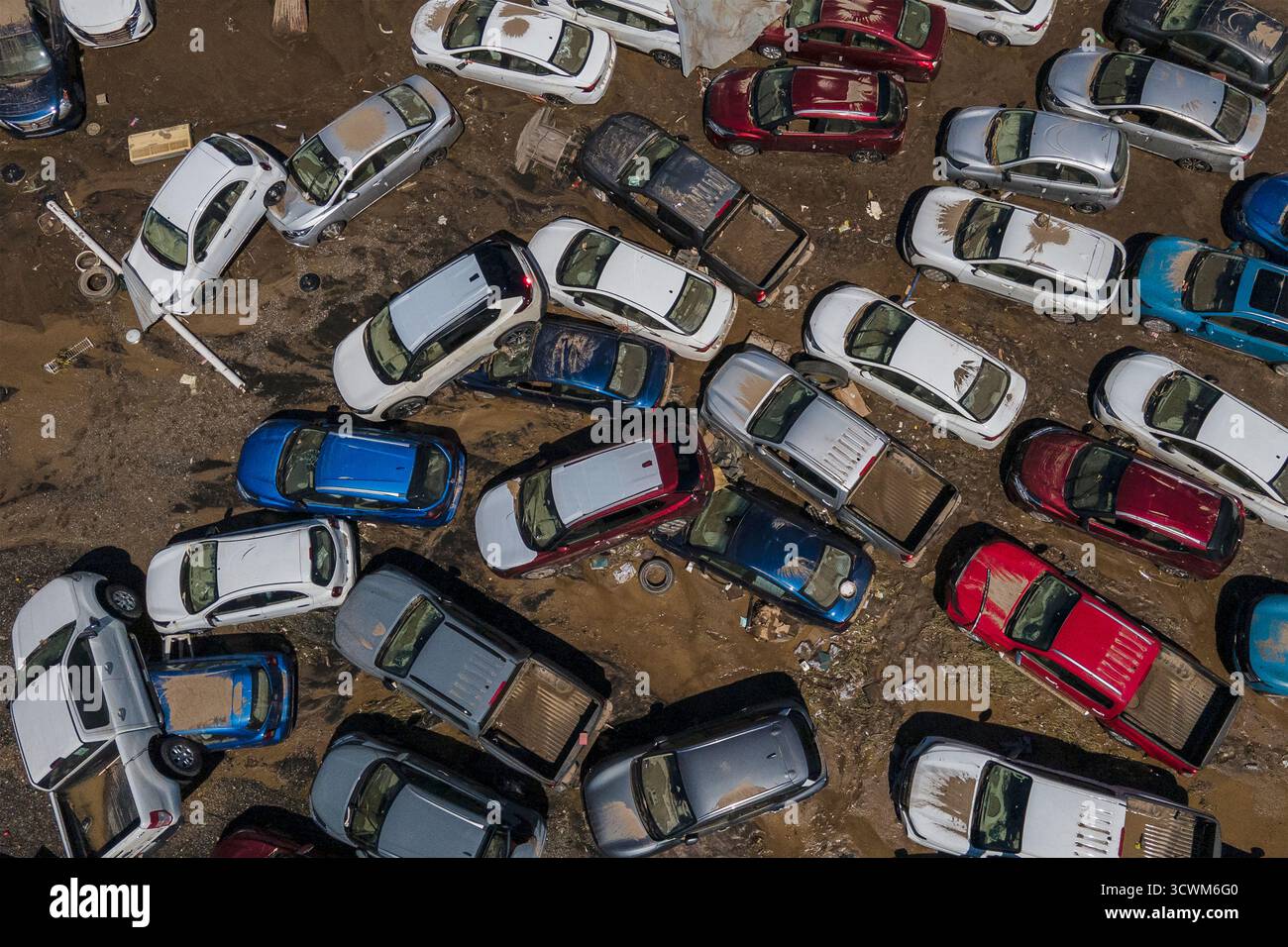 Damaged vehicles sit in mud after flooding in Poza Rica, Veracruz state ...
