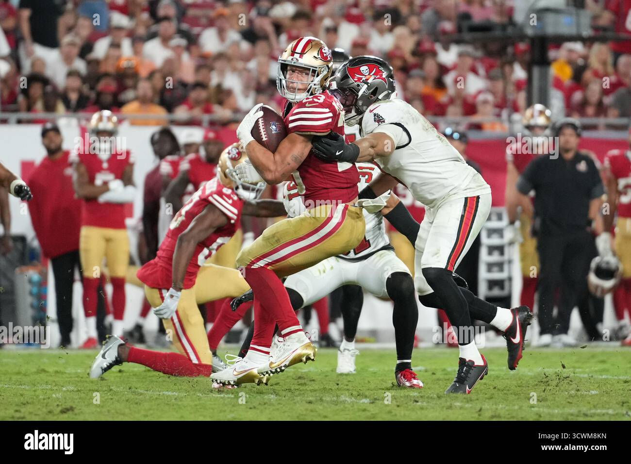 San Francisco 49ers running back Christian McCaffrey (23) spins out of ...
