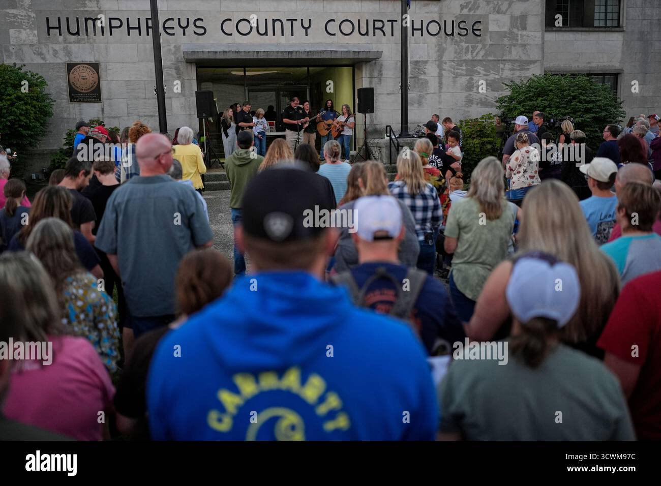 People gather outside the Humphreys County Courthouse for a candlelight ...