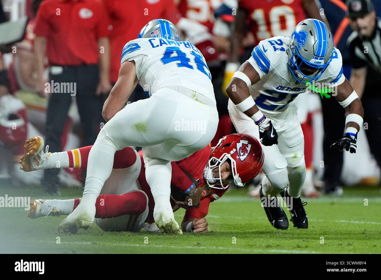 Kansas City Chiefs quarterback Patrick Mahomes, bottom, is tackled by ...