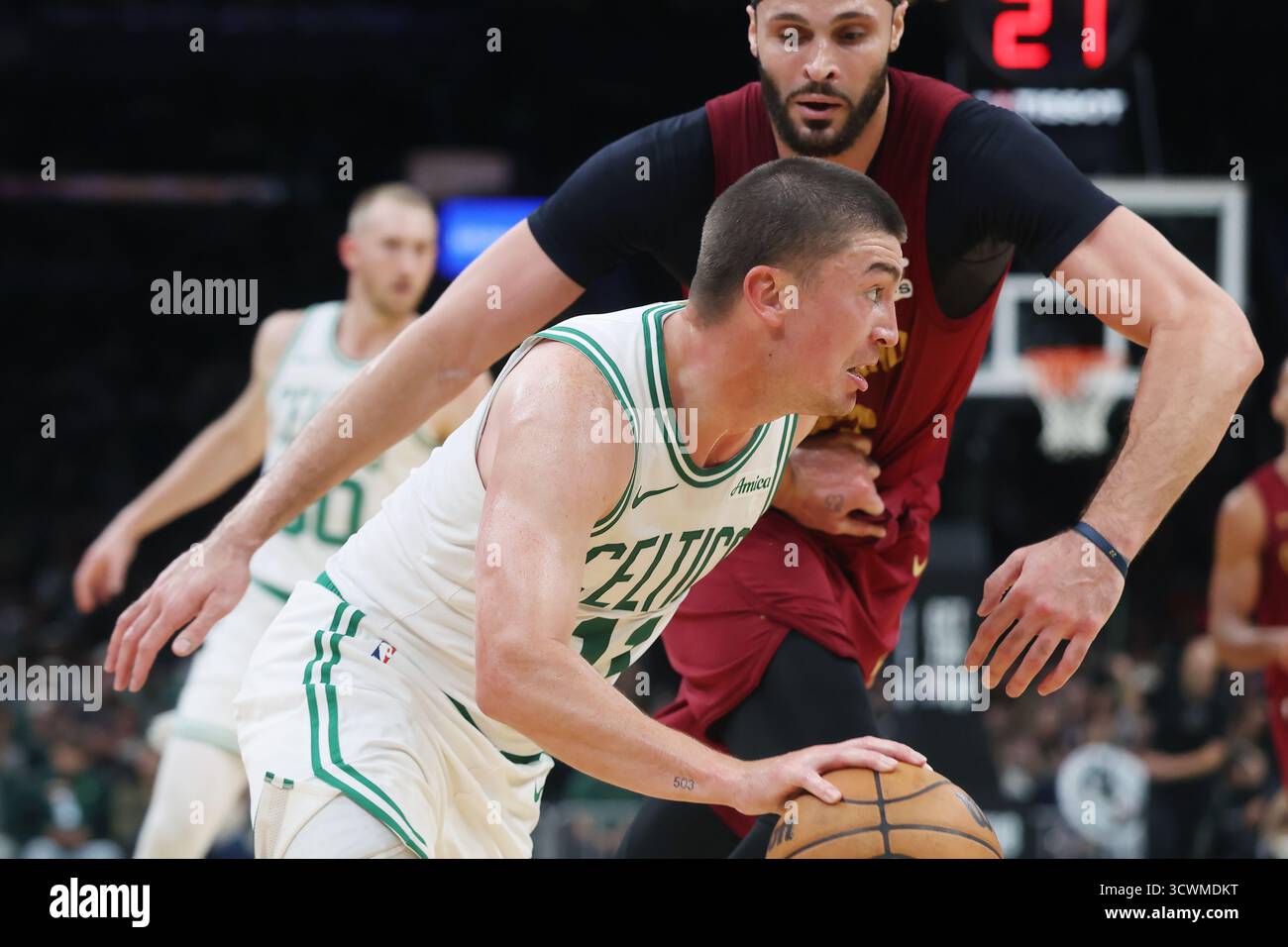 Boston Celtics' Payton Pritchard, front, drives past Cleveland Cavaliers' Larry Nance Jr., top ...