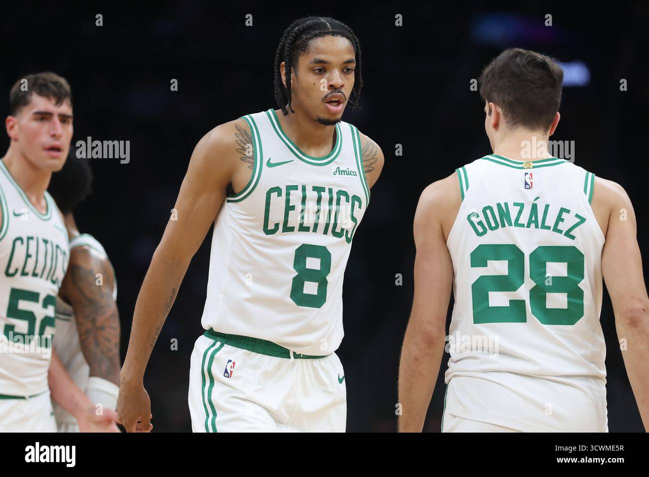 Boston Celtics' Josh Minott (8), Hugo González (28) and Luka Garza (52 ...