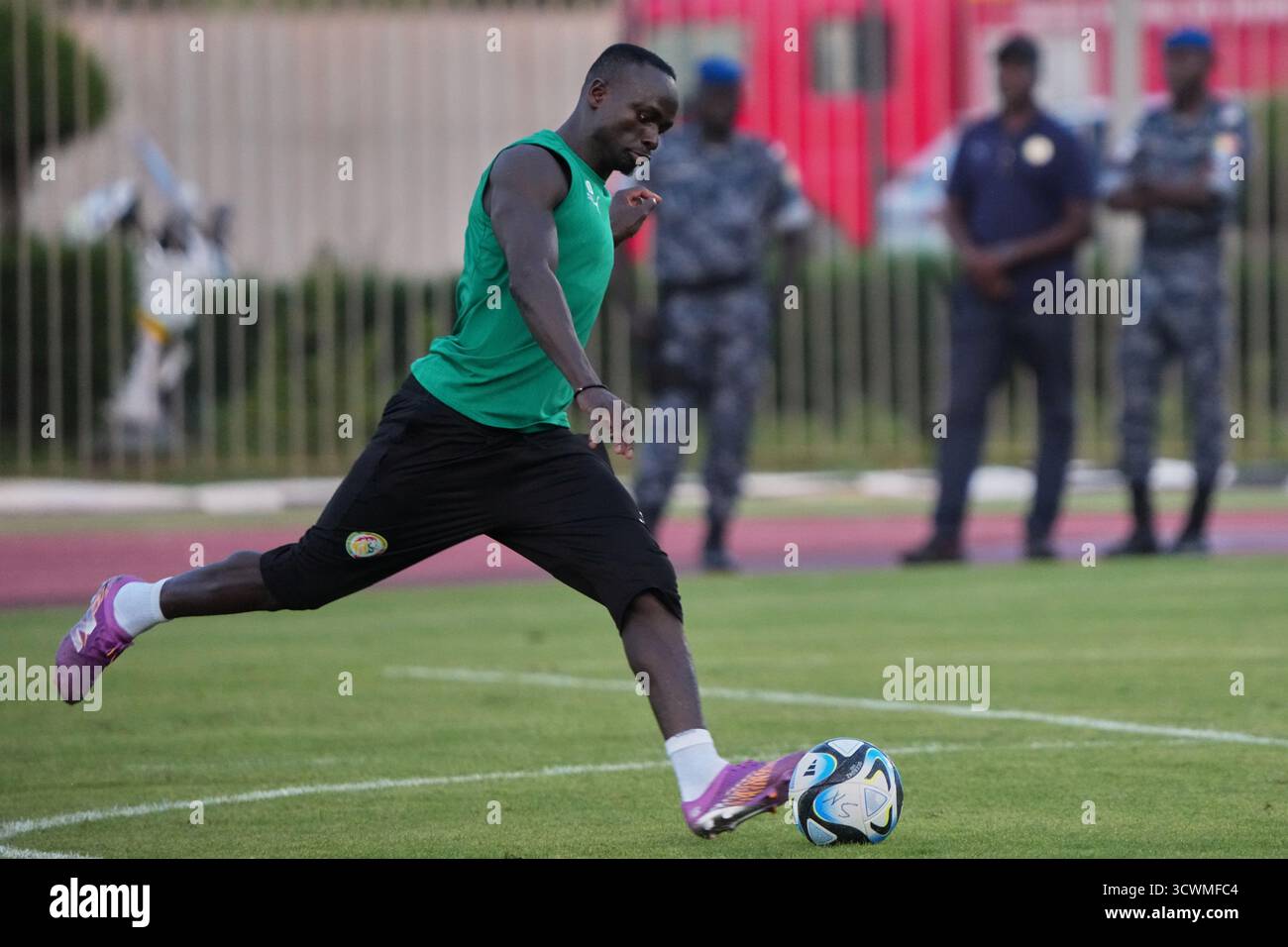 Sadio Mané prepares to kick a ball during Senegal's training session ...