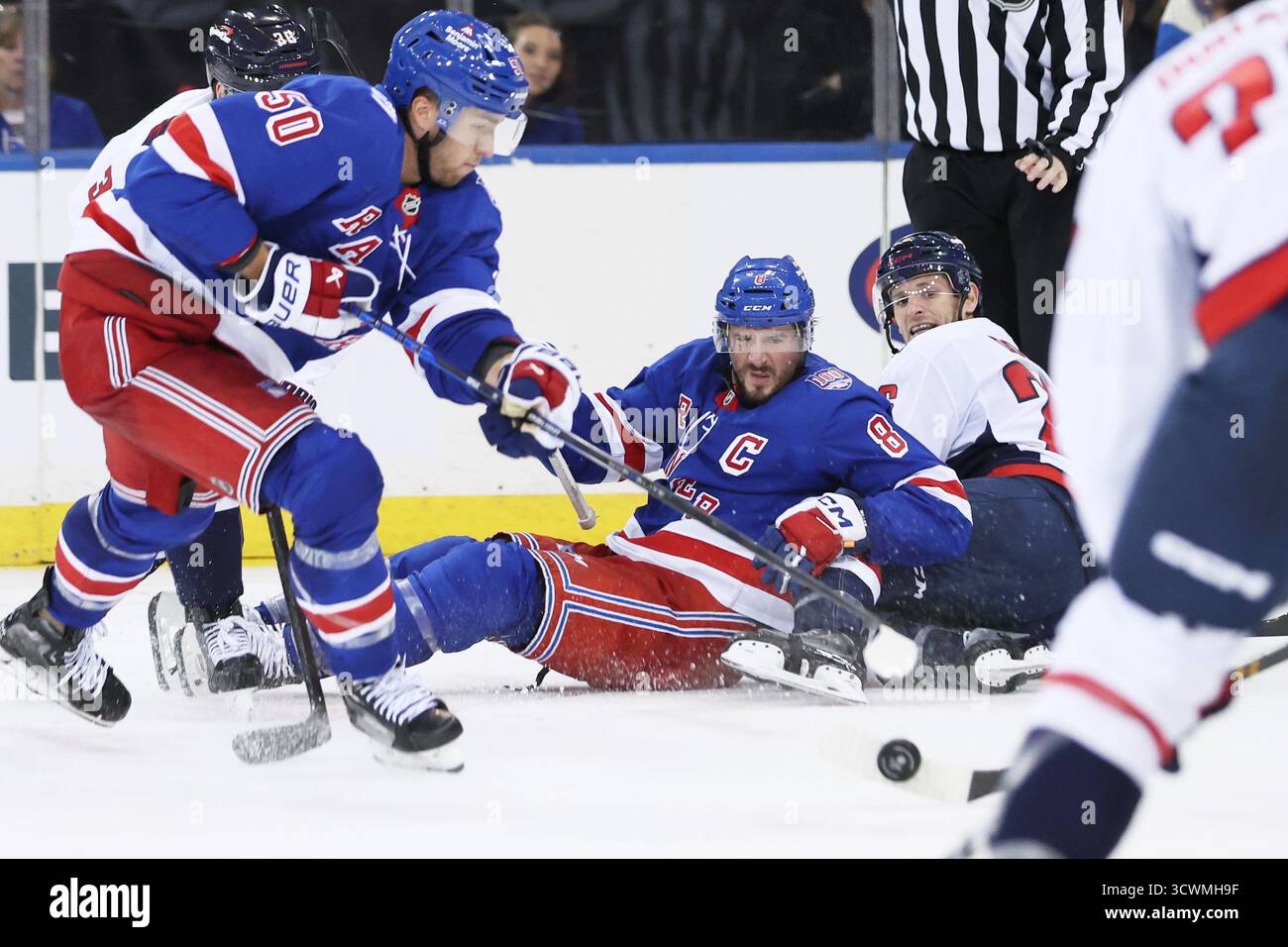 New York Rangers' J.T. Miller (8) and Washington Capitals' Nic Dowd ...