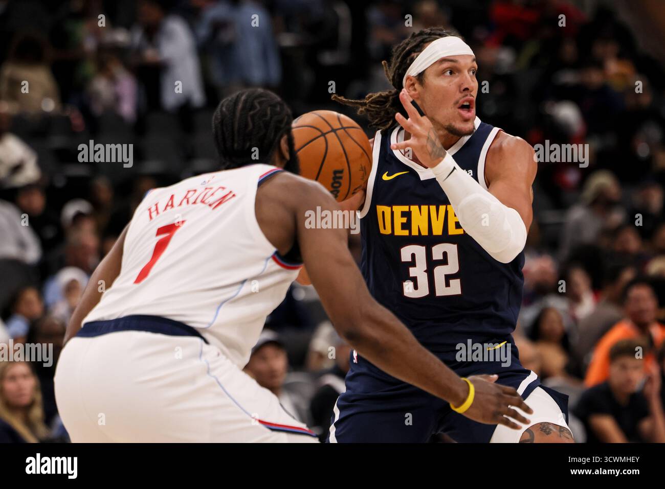 Denver Nuggets forward Aaron Gordon, right, dribbles past Los Angeles ...