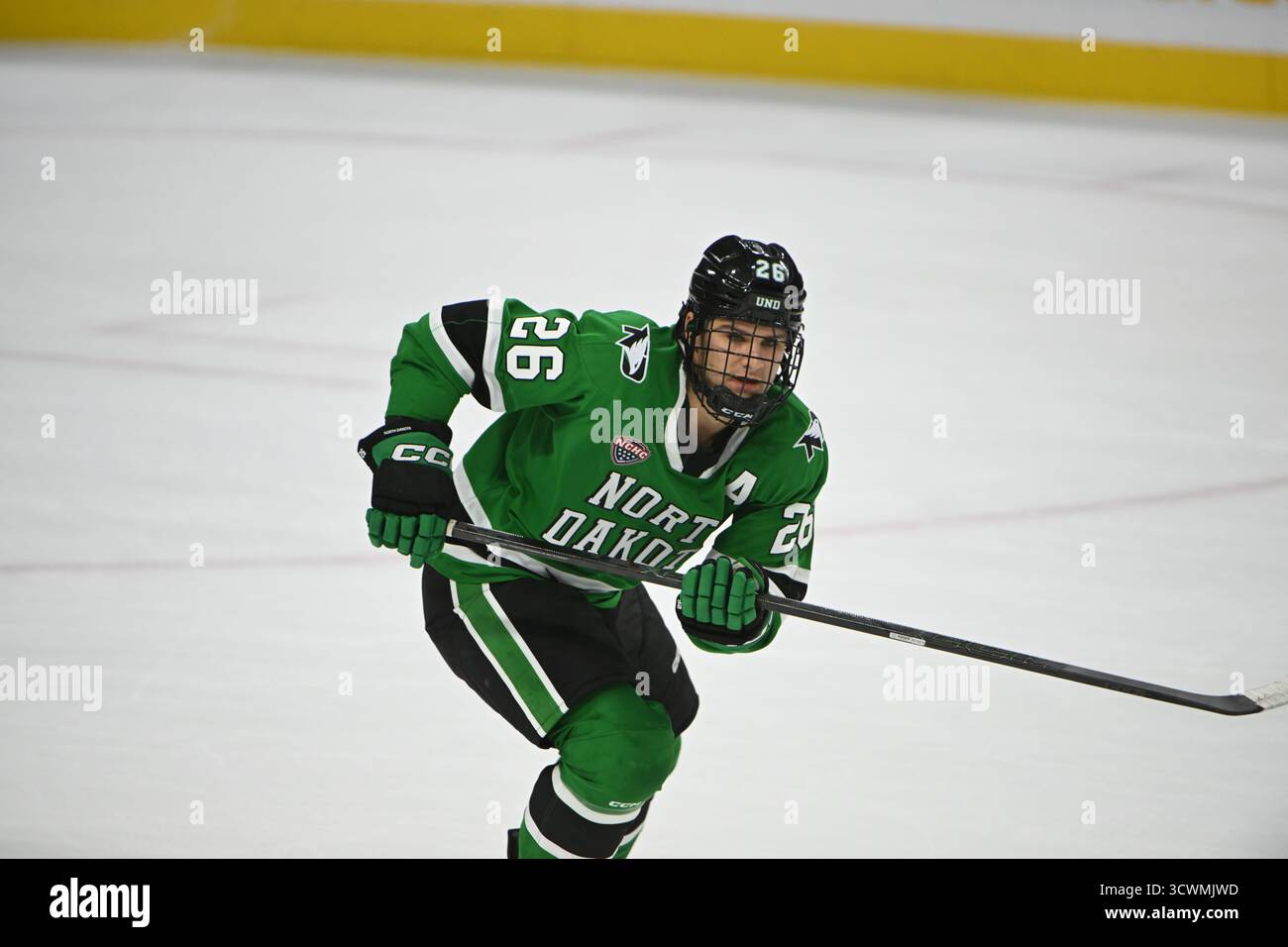 North Dakota forward Dylan James skates to the puck during their game ...