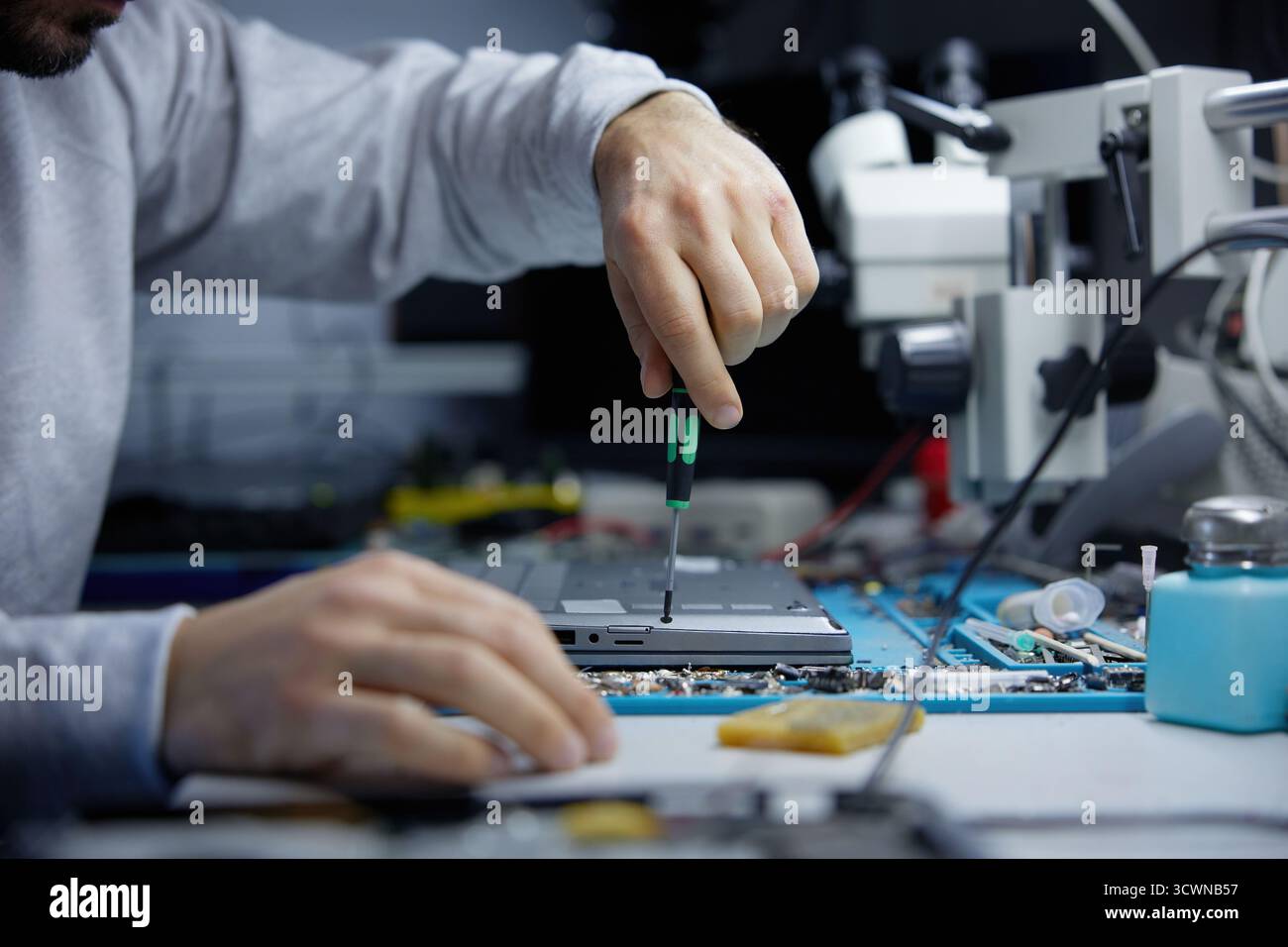 Technician carefully repairing circuit hi-res stock photography and ...