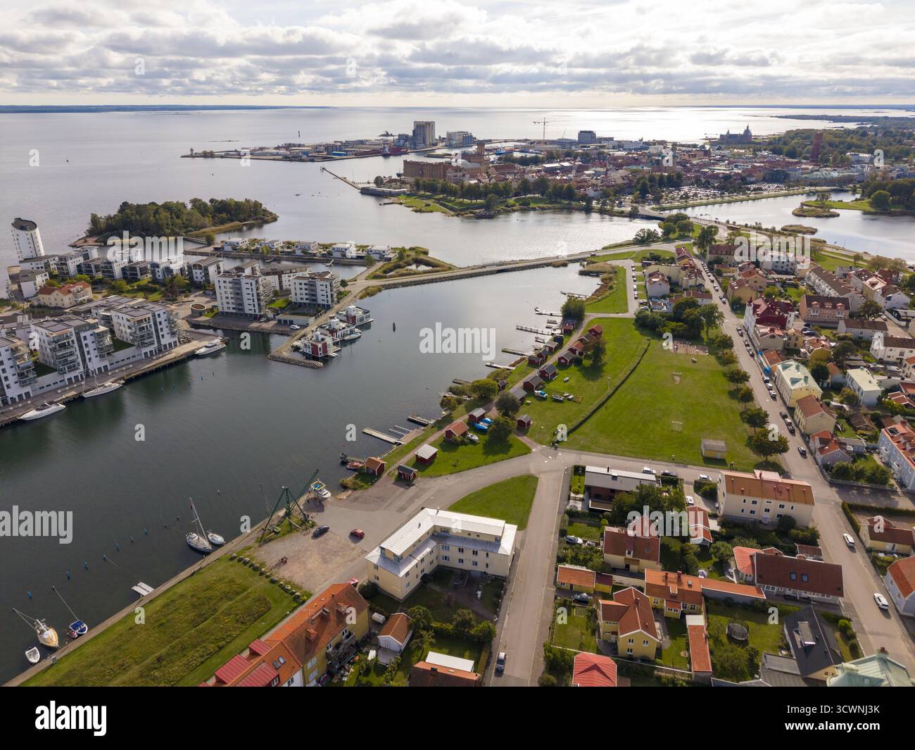 Aerial view of the shimmering waters embracing the modern architecture ...