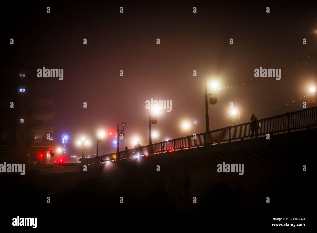 Bridge Lights and Eerie Red Fog Stock Photo - Alamy
