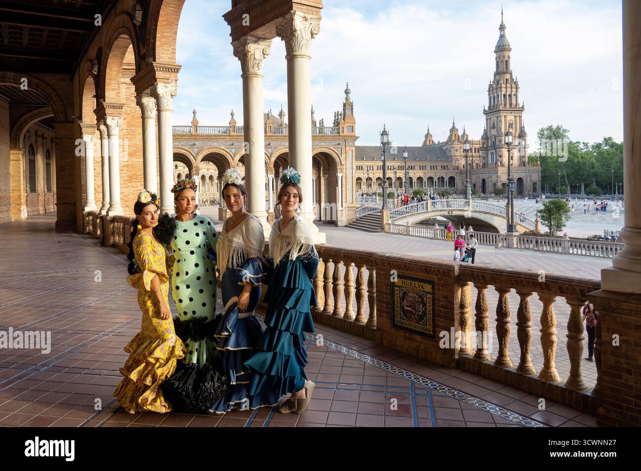 Sevilla, Spain - 23 Apr 23: Four women in traditional flamenco dresses ...