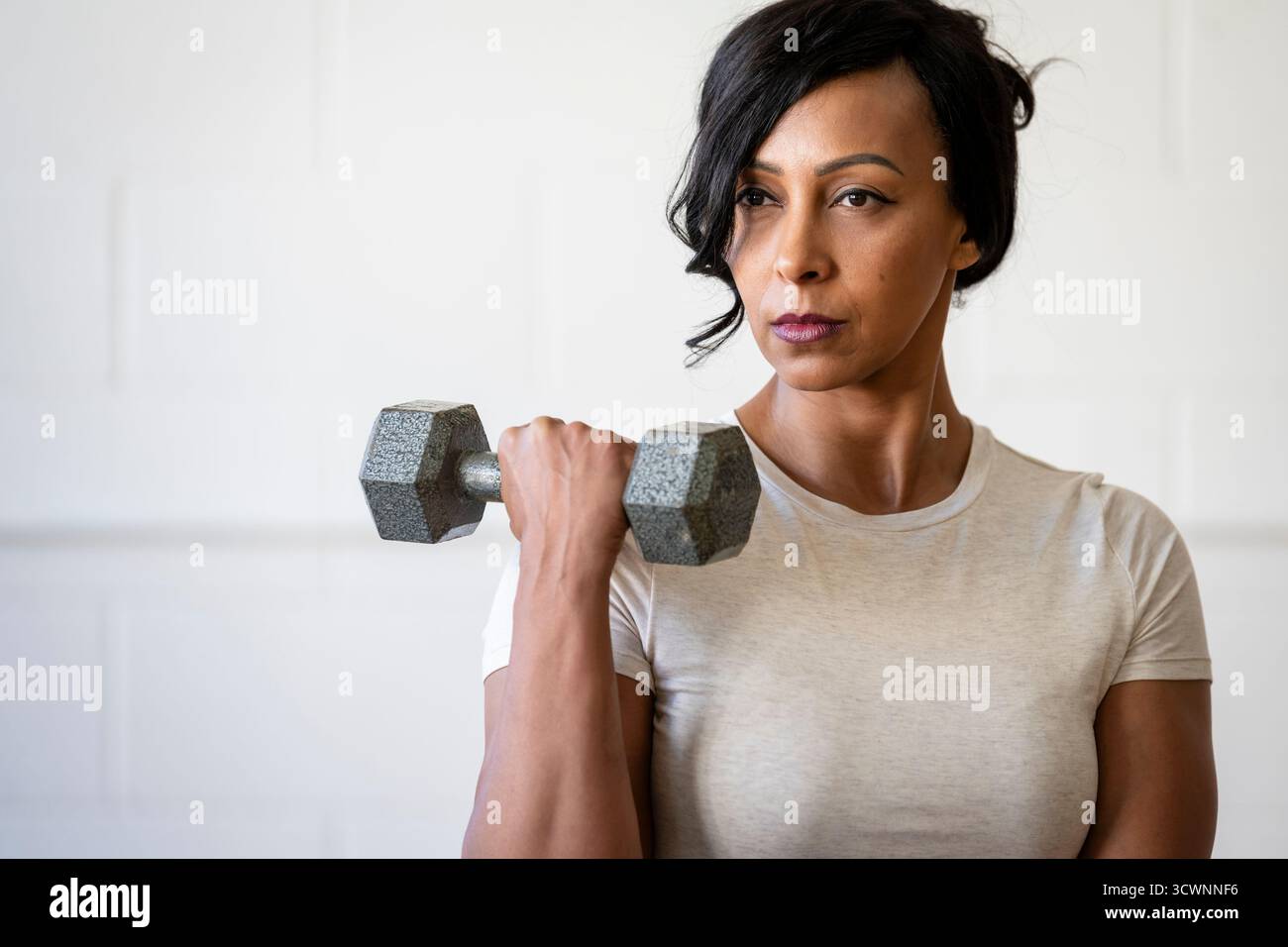 Focused african american woman training hi-res stock photography and ...