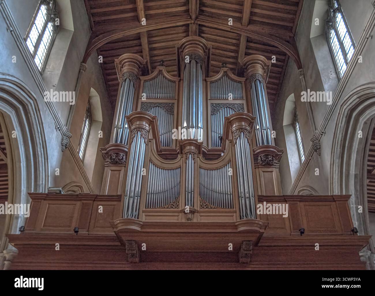 Pipe organ inside a historic church with wooden architecture and arched ...
