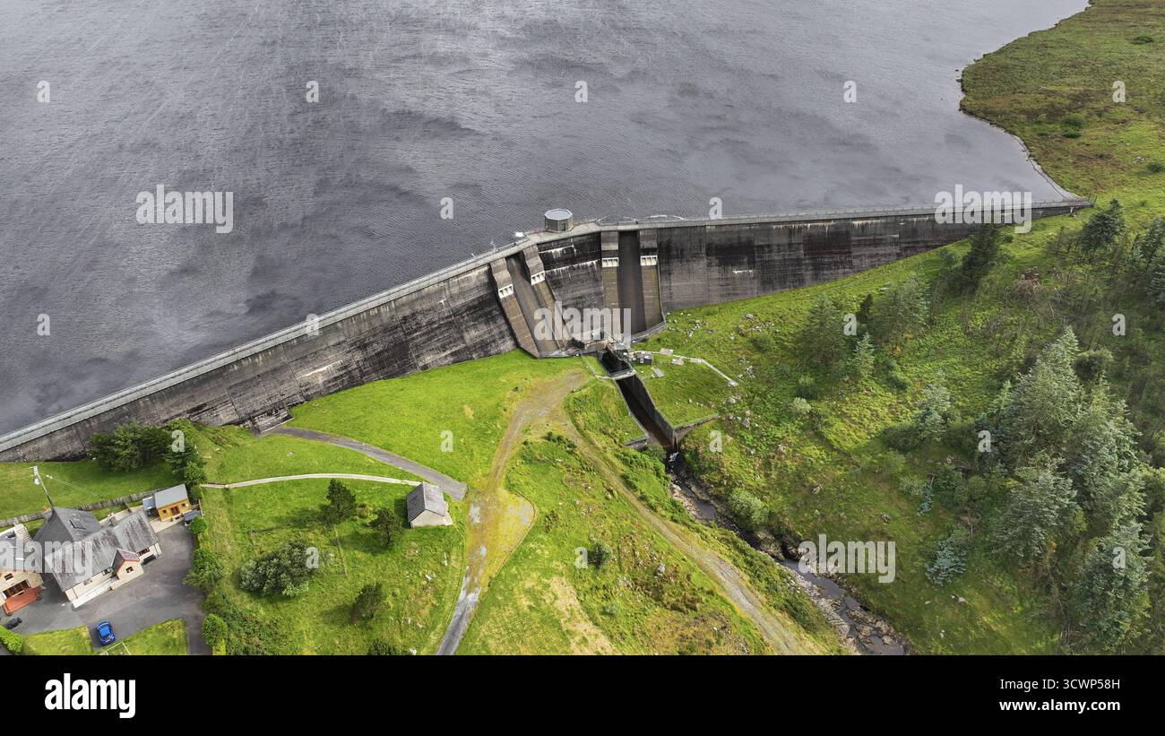 Aerial view of the imposing Spelga Dam, a concrete barrier against the ...