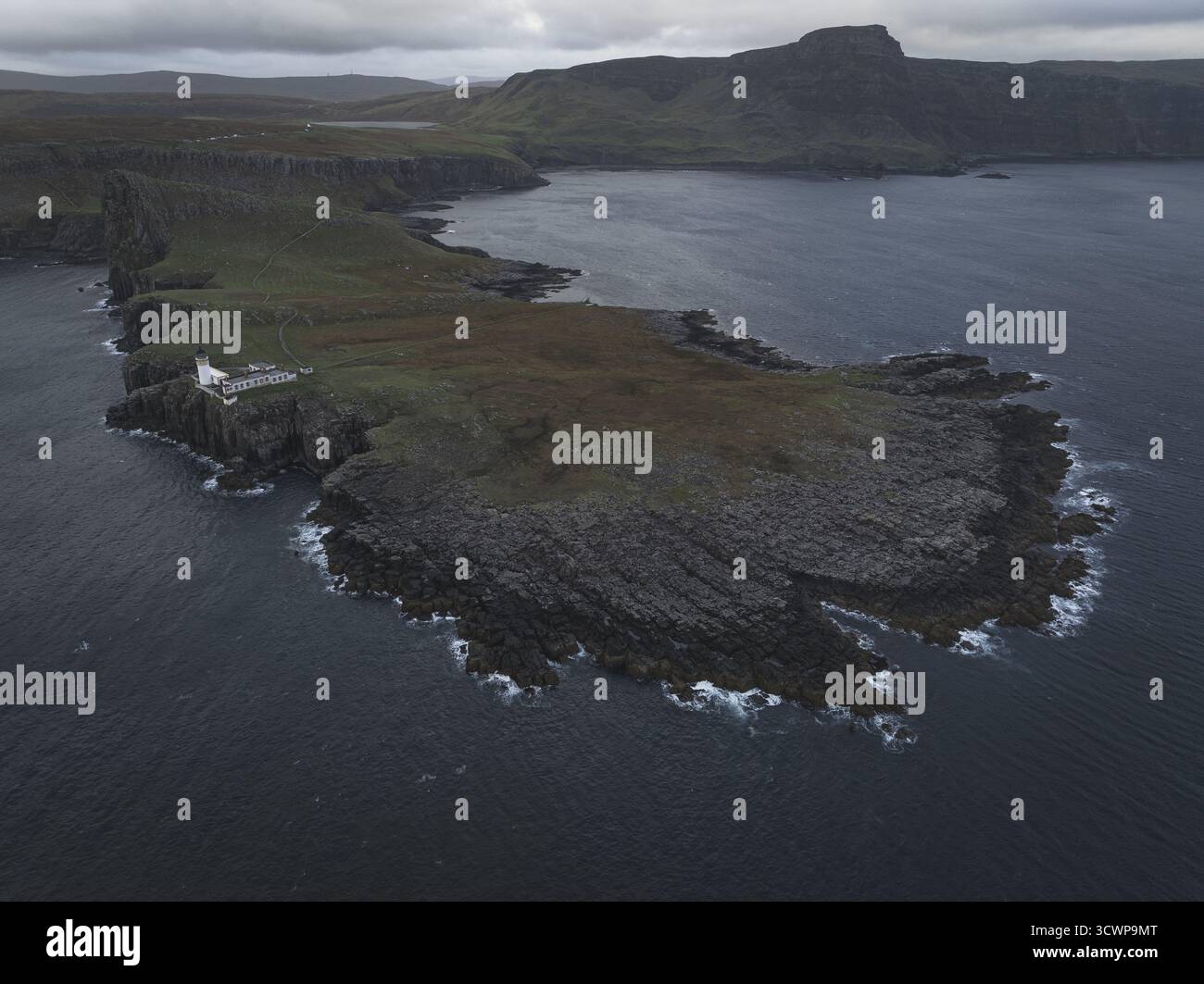 Aerial view of Neist Point Lighthouse standing proudly against the ...