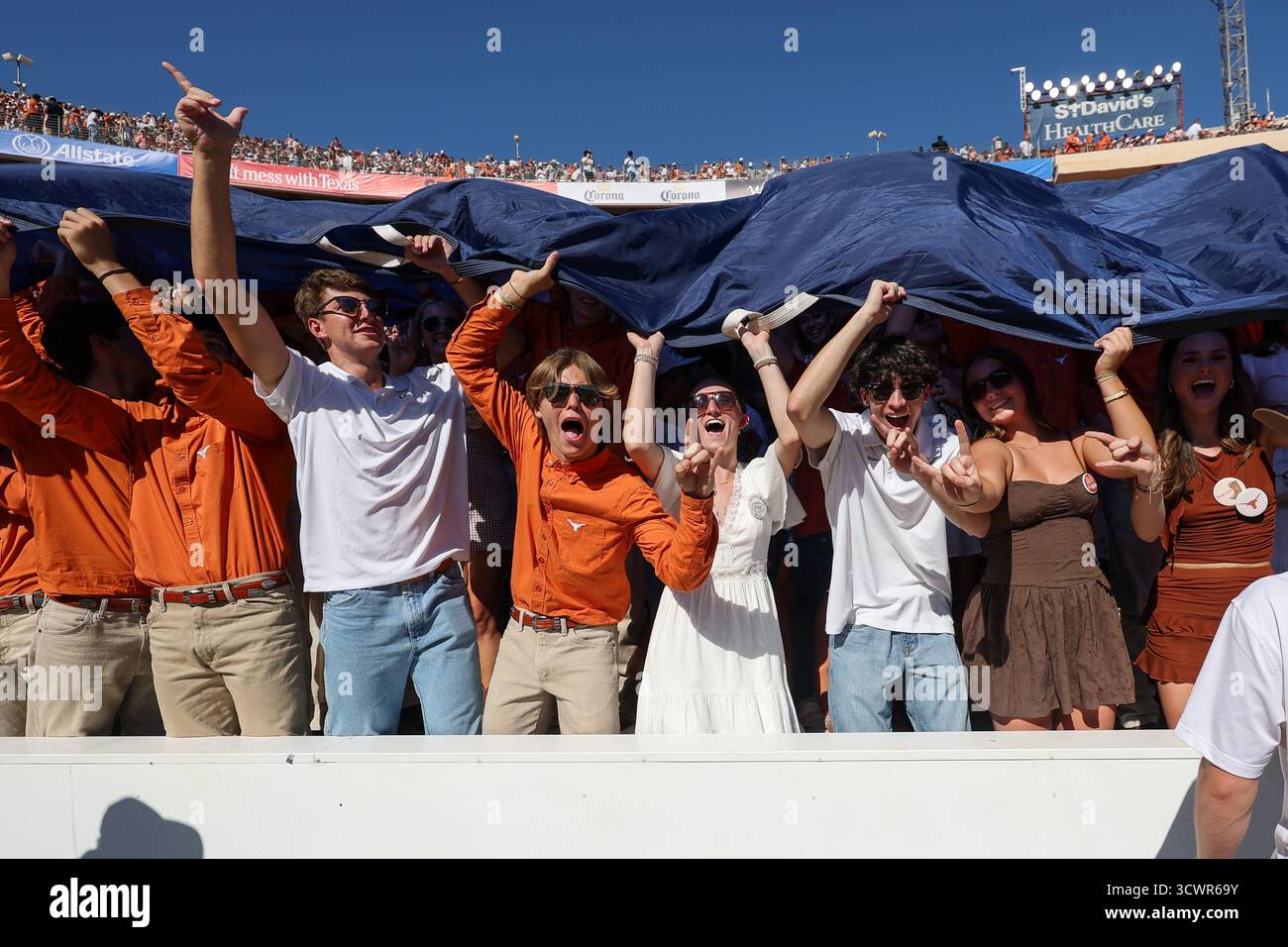 DALLAS, TX - OCTOBER 11: Texas Longhorns fans hold and waive the Texas ...