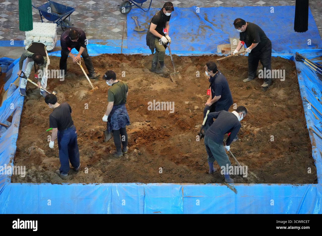 Workers build up the dohyo, the sacred sumo wrestling ring and the ...