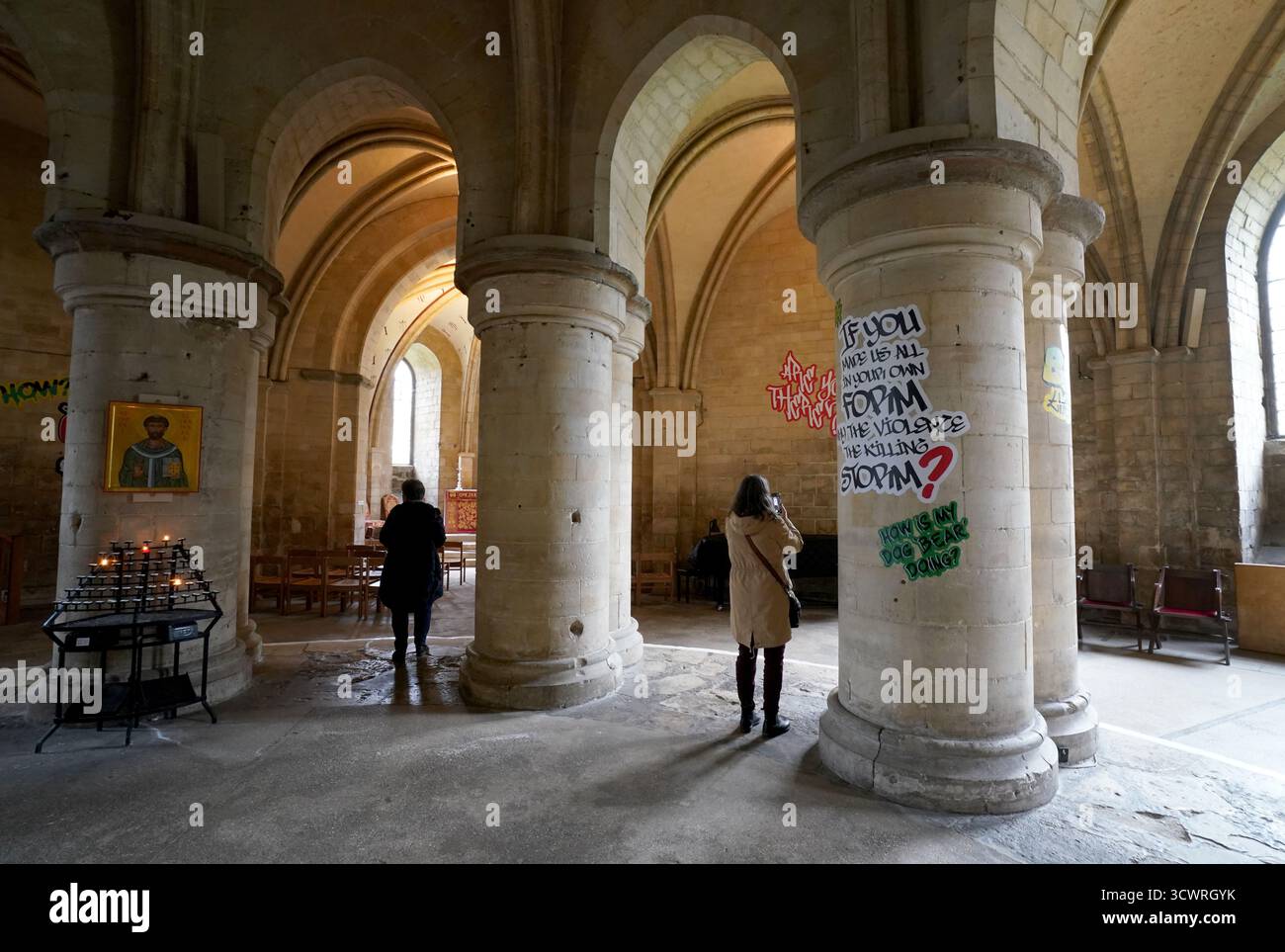 Visitors view graffiti artwork from the 'Hear Us' installation, a ...
