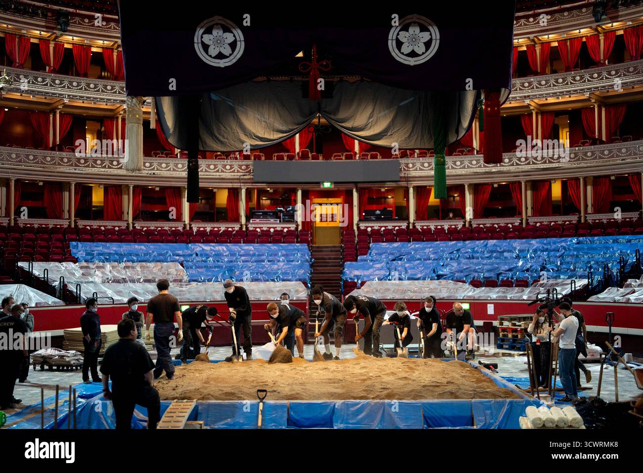 The soil and concrete are turned over during the construction of the ...