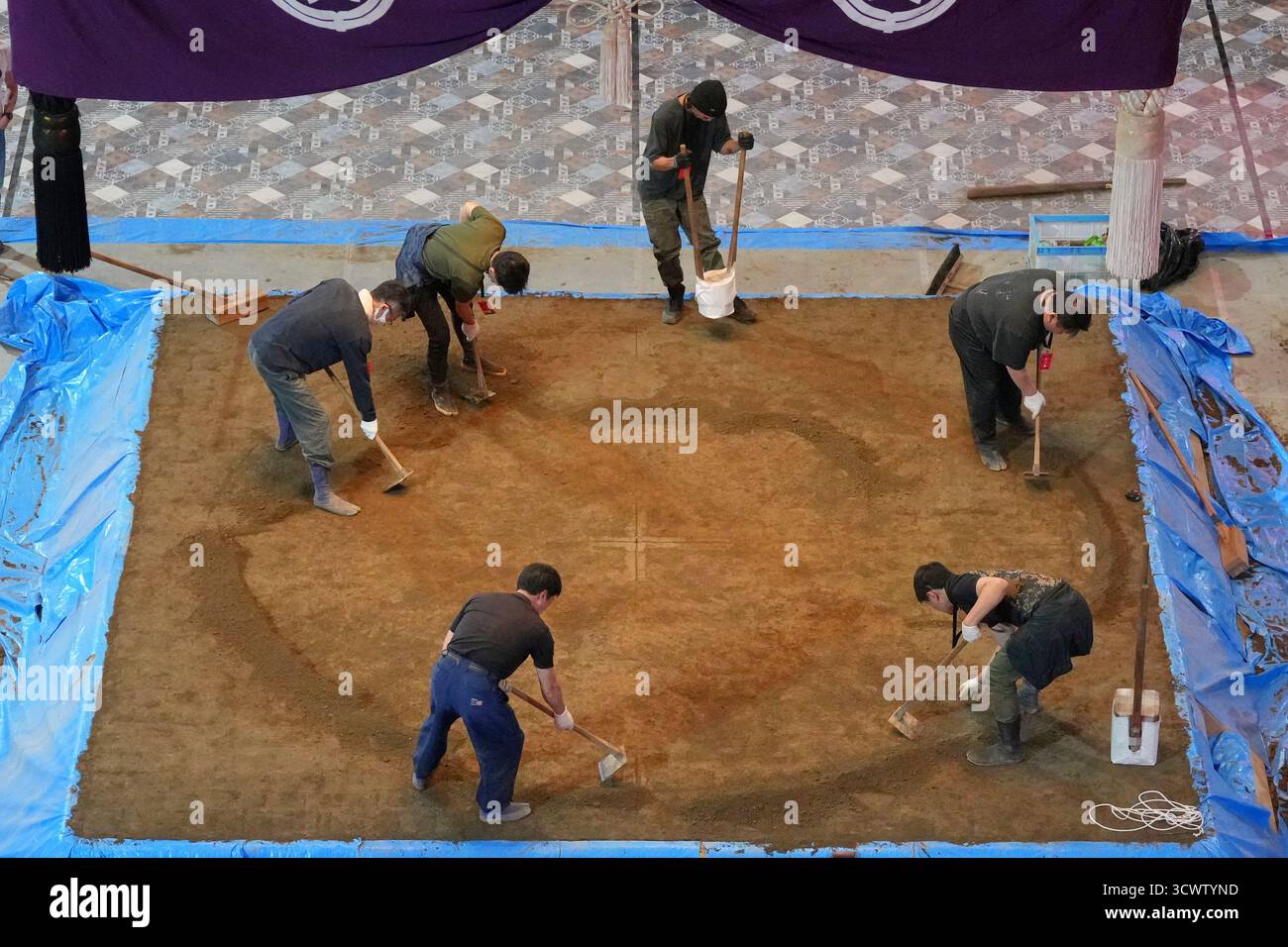 Workers build up the dohyo, the sacred sumo wrestling ring and the ...