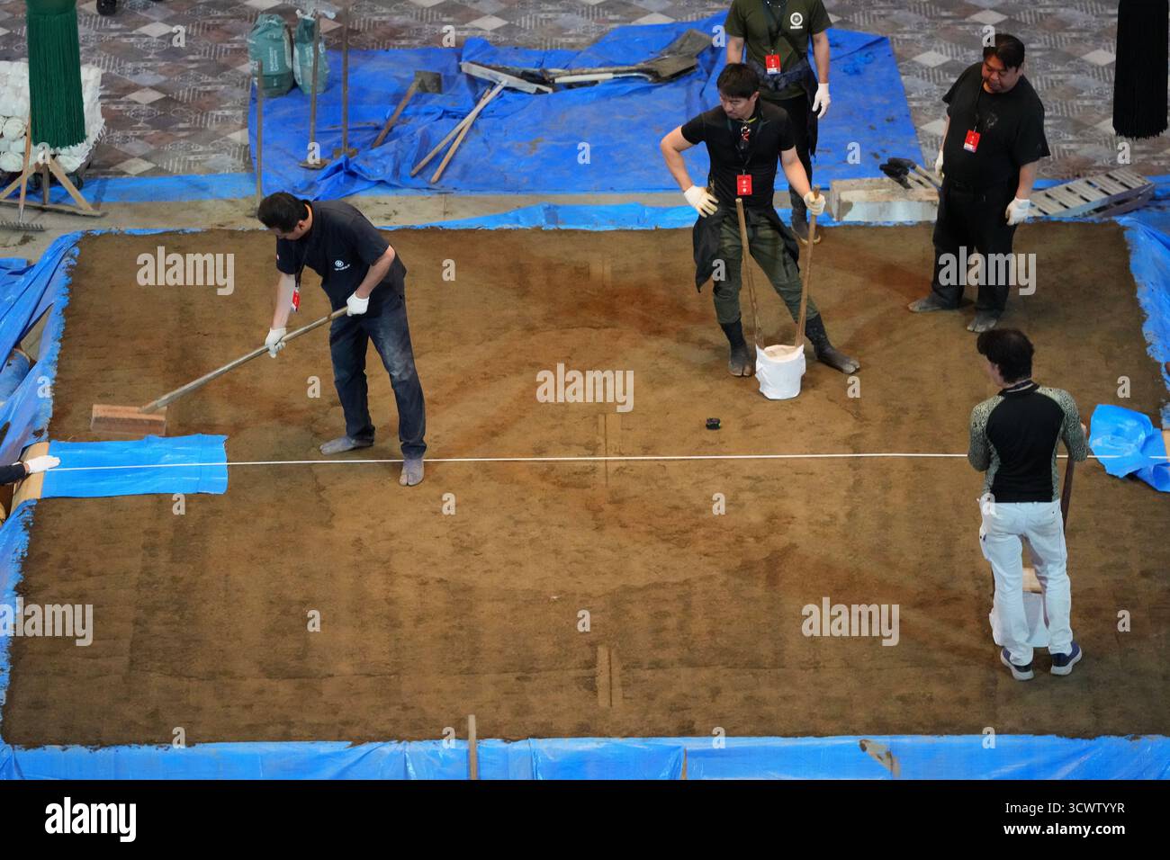 Workers build up the dohyo, the sacred sumo wrestling ring and the ...