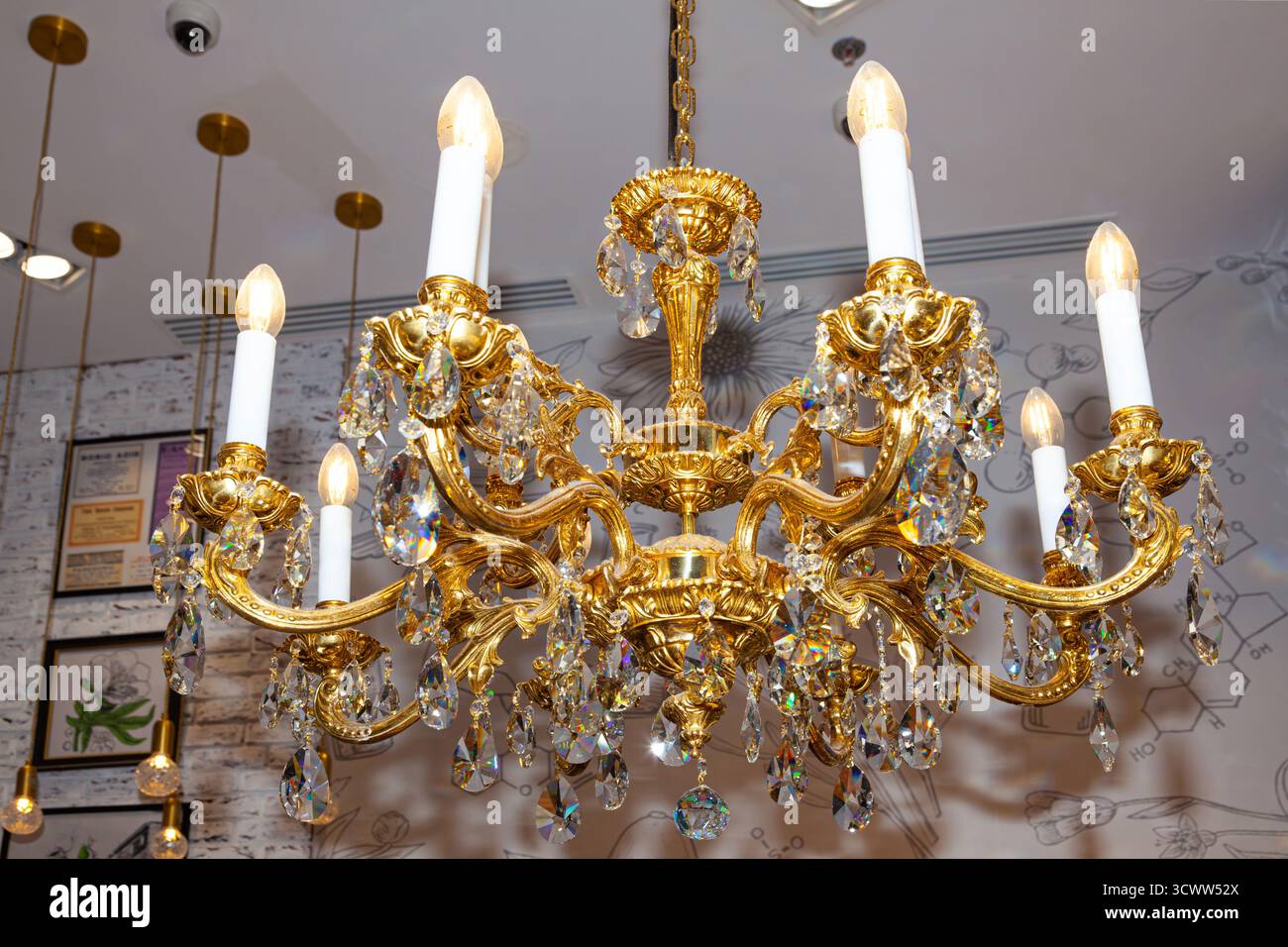 Golden chandelier hanging from hi-res stock photography and images - Alamy