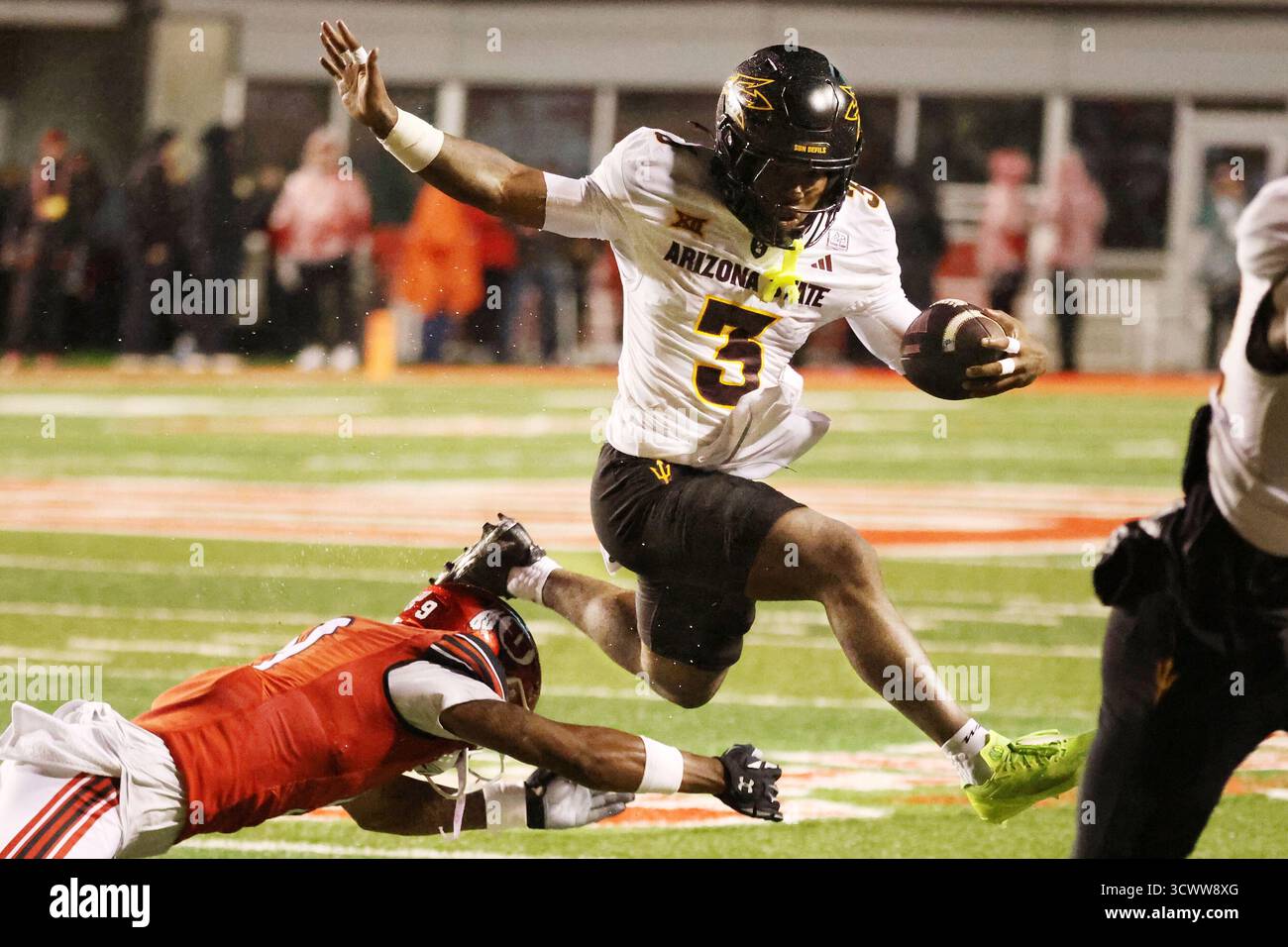 Arizona State running back Raleek Brown runs by Utah cornerback Elijah ...