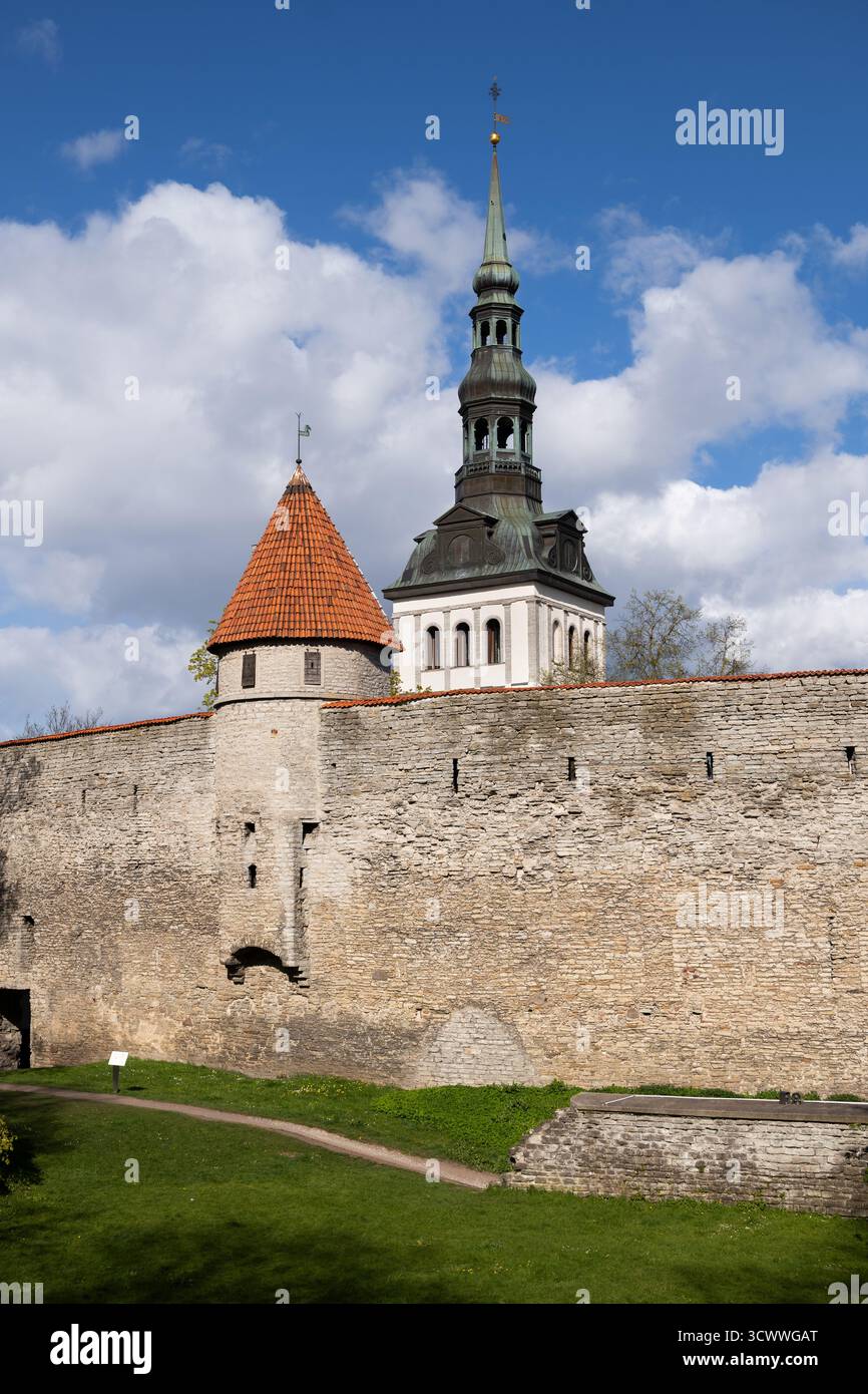Tower of Saint Nicholas Church above city wall with turret ...