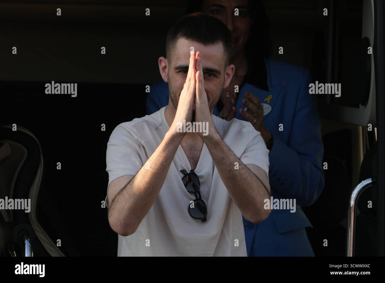Freed Israeli hostage Avinatan Or gestures from a van as he arrives at ...