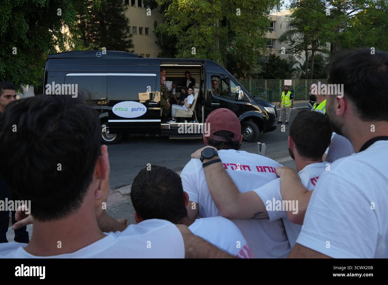 Freed Israeli hostage Evyatar David gestures from a van as he arrives ...