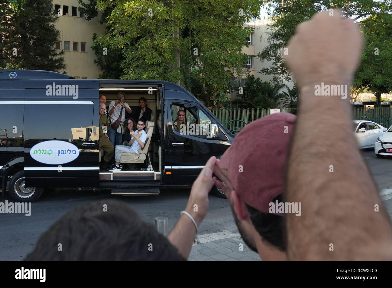 Freed Israeli hostage Evyatar David gestures from a van as he arrives ...