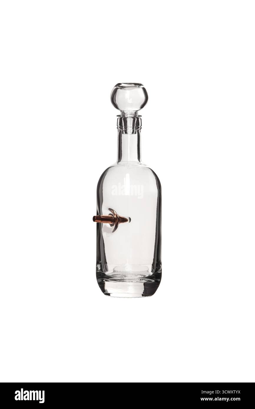 A clear glass liquor bottle decanter with an embedded copper bullet and ...