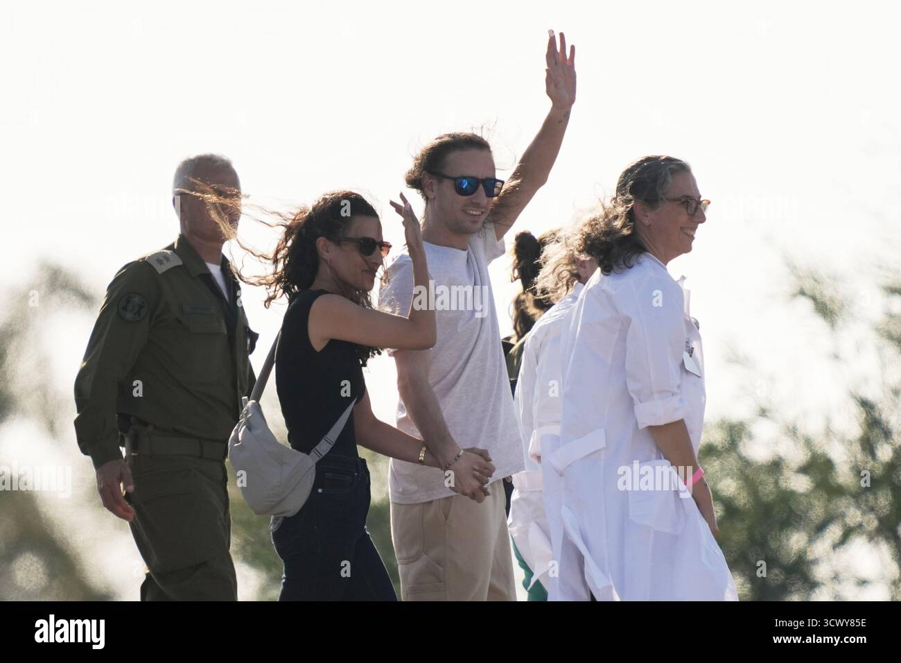 Ariel Cunio, an Israeli hostage released from the Gaza Strip waves at ...