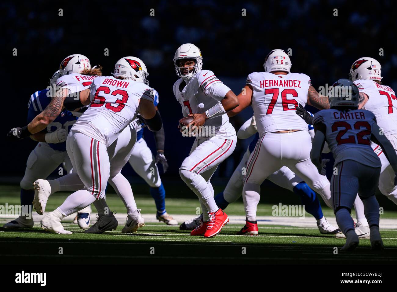 Arizona Cardinals quarterback Jacoby Brissett (7) hands off the ball ...