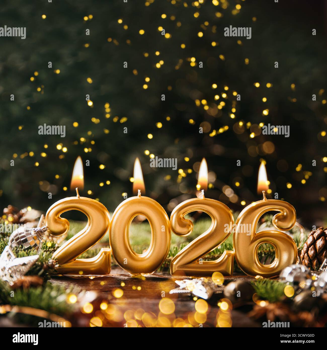 Holiday background Happy New Year 2026. Numbers of year 2026 made by gold burning candles on ...