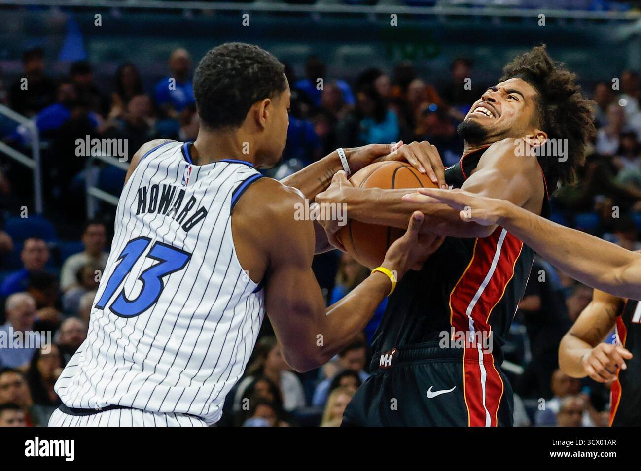 Orlando Magic guard Jett Howard (13) defends Miami Heat guard Ethan ...