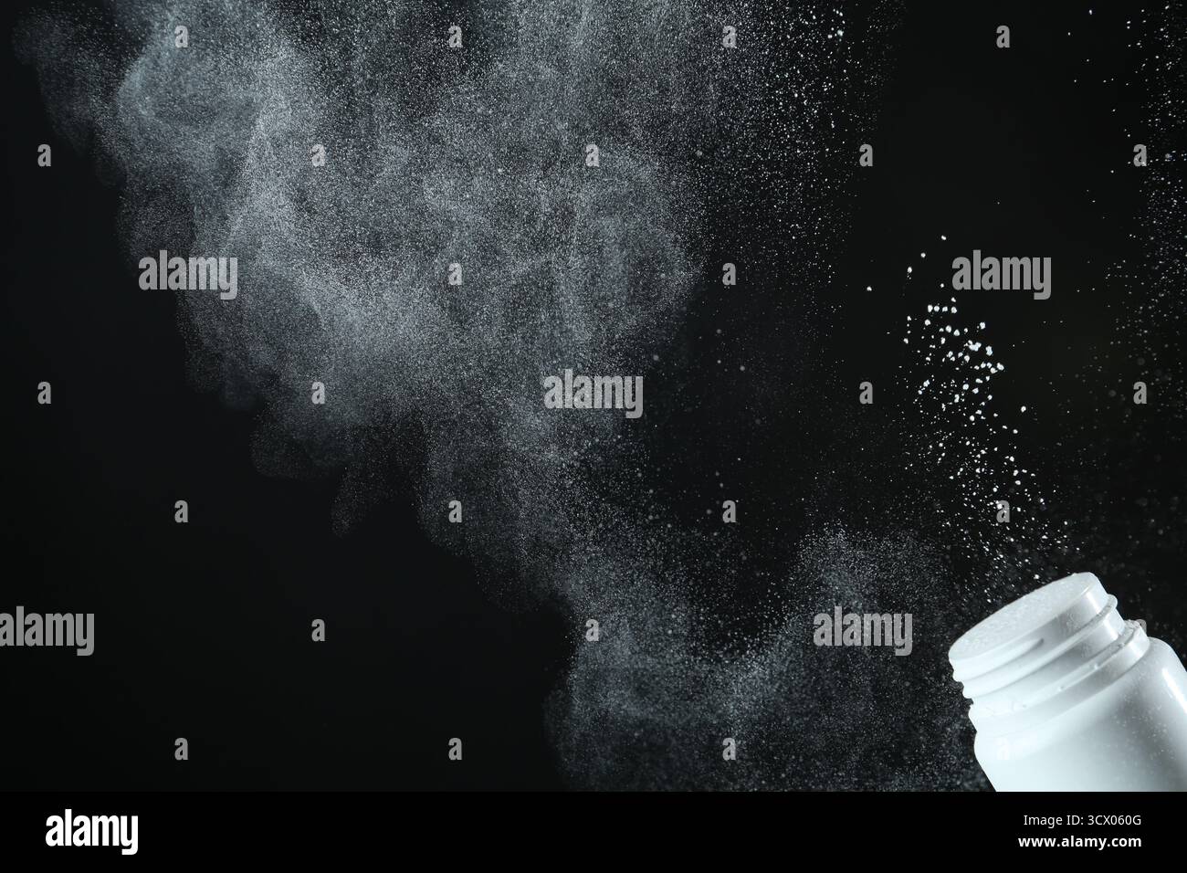 Container with talcum powder on black background, closeup Stock Photo ...
