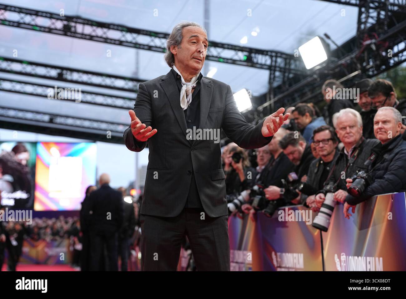 Composer Alexandre Desplat poses for photographers upon arrival at the ...