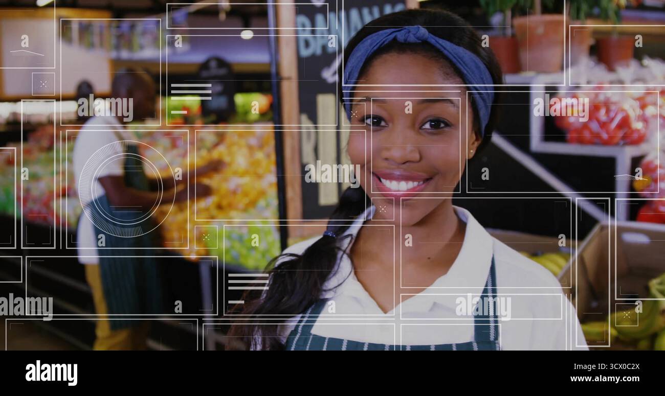 Smiling female employee in striped apron arranging produce at grocery ...