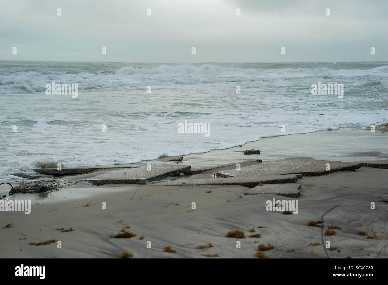 Concrete sits on a beach after a storm, Monday, Oct. 13, 2025, in ...